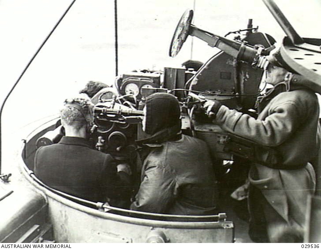 HMAS AUSTRALIA, AT SEA. 1943-02. ONE OF THE MULTIPLE 2 PDR (40MM) QF ...