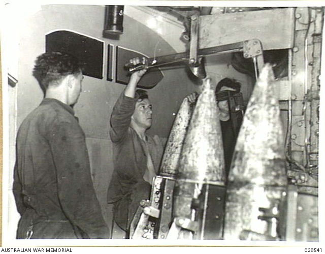 HMAS AUSTRALIA, AT SEA. 1943-02. THE SHELL HANDLING ROOM CREW OF HMAS ...
