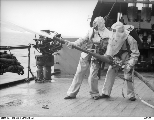 HMAS AUSTRALIA, AT SEA. 1943-02. MEMBERS OF ONE OF HMAS AUSTRALIA'S ...