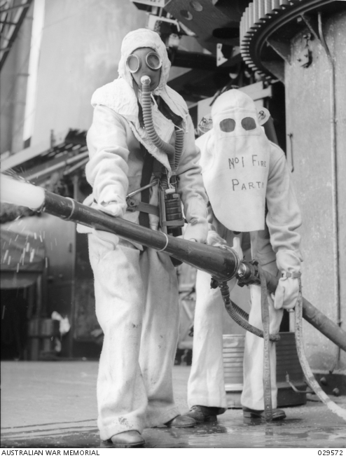 HMAS AUSTRALIA, AT SEA. 1943-02. MEMBERS OF ONE OF HMAS AUSTRALIA'S ...