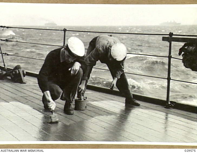HMAS AUSTRALIA, AT SEA. 1943-02. SAILORS OF HMAS AUSTRALIA PAINTING THE ...