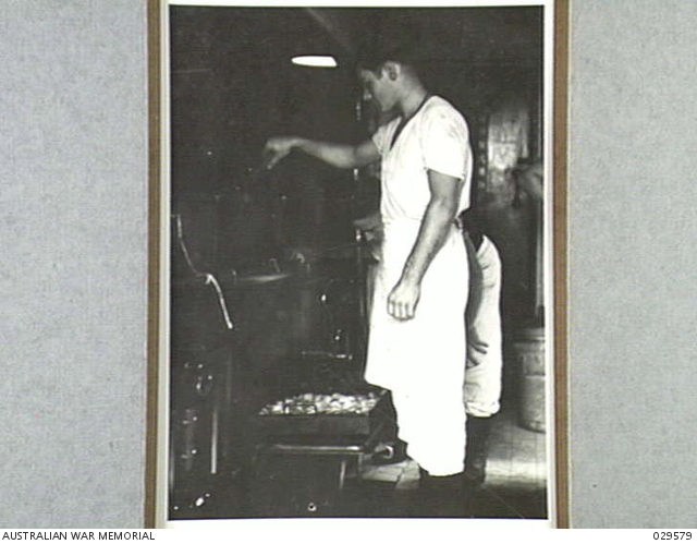 HMAS AUSTRALIA, AT SEA. 1943-02. A SCENE INSIDE THE GALLEY OF HMAS ...