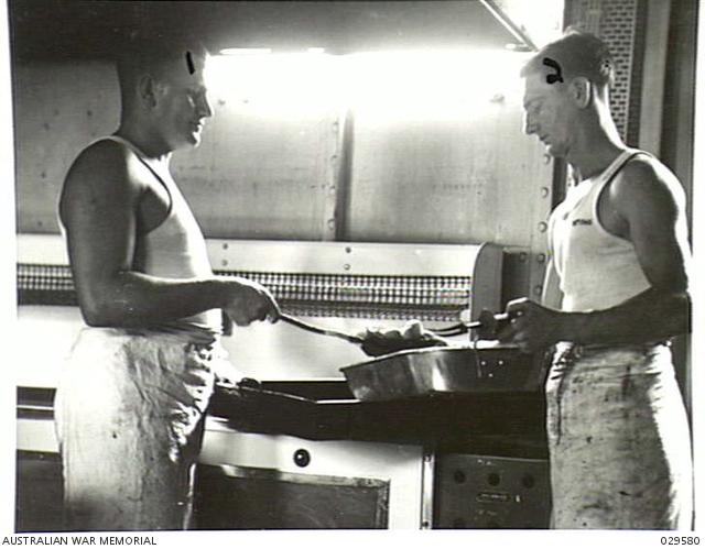 HMAS AUSTRALIA, AT SEA. 1943-02. THE SHIP'S COOKS OF HMAS AUSTRALIA AT ...