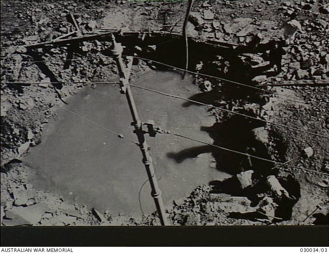 Crater caused by bomb which dropped in the centre of tram track in ...