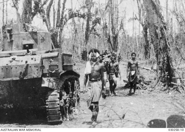 Sanananda, Papua. January 1943. Papuan native carriers, bringing back ...