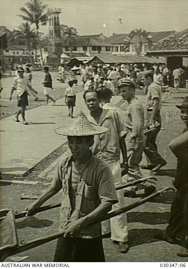 Kuching, Sarawak. 12 September 1945. Street scene in Kuching. A ...