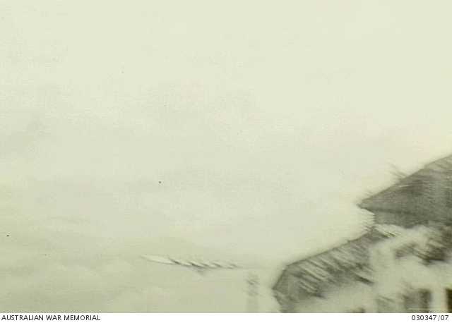 Kuching, Sarawak. 12 September 1945. Blurred immage, subject obscure ...