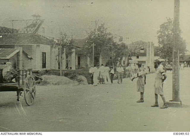 Kuching, Sarawak. 12 September 1945. Street scene in Kuching. Note the ...