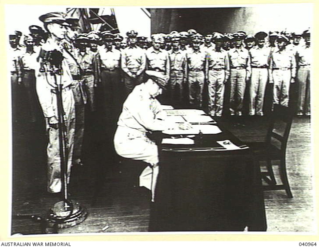 General Douglas MacArthur signing the surrender document for the ...