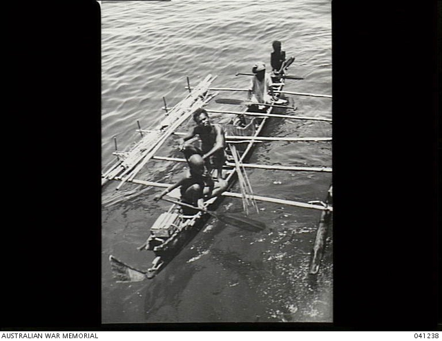 Biak Island, Dutch New Guinea. c. 1943. A native family aboard a ...