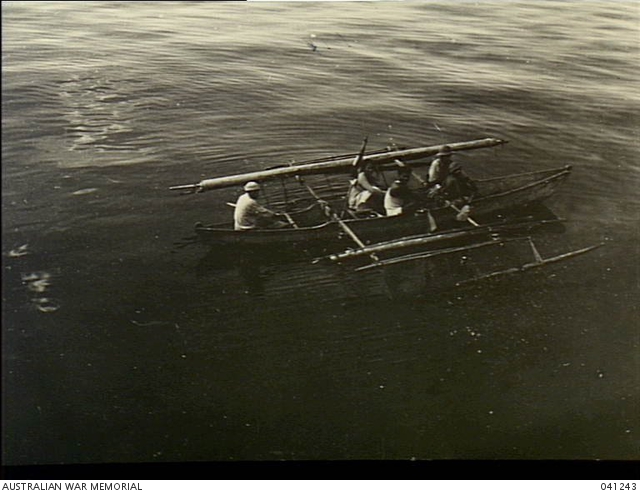 Los Negros Island, Admiralty Group. c. 1943. Five natives in a small ...