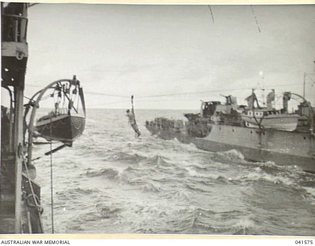 AT SEA, 1945-04. OPERATION CASE BEING TRANSFERRED FROM H.M.A.S ...