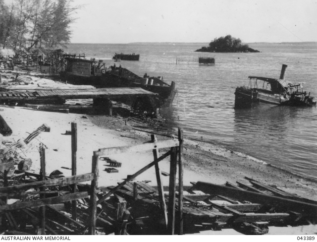 BALIKPAPAN, BORNEO, 1945-07. WRECKED FORESHORES AND DAMAGED BOAT CAUSED ...
