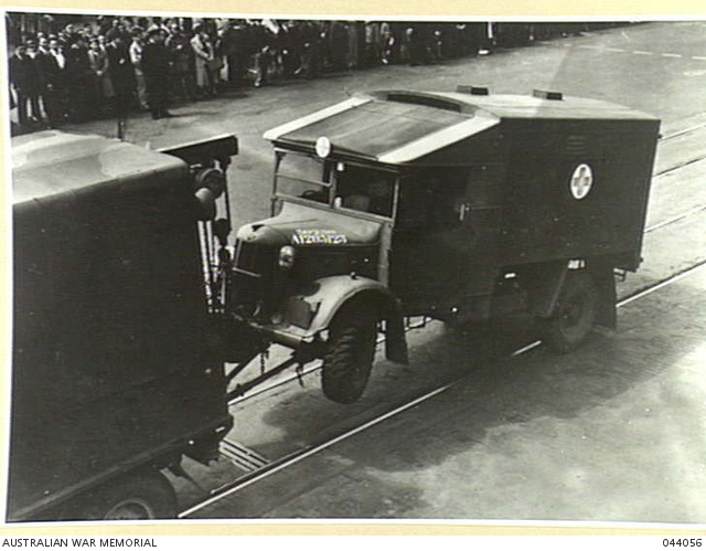 An Australian Army recovery vehicle towing an Austin K2Y Ambulance ...