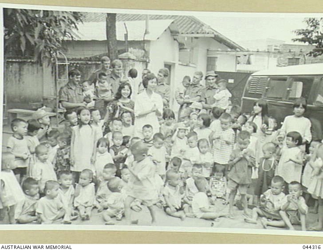 Asia. c. 1979. Australian soldiers with a group of Asian children ...