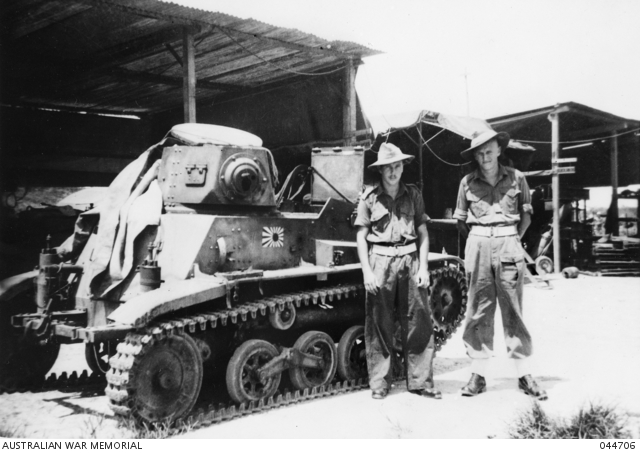 PRIVATE MCDOUGALL (LEFT) STANDING ALONGSIDE THE JAPANESE TYPE 94 LIGHT ...