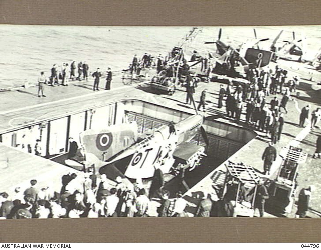 CLEARING THE FLIGHT DECK OF HMAS SYDNEY AFTER A FAIREY FIREFLY AIRCRAFT ...