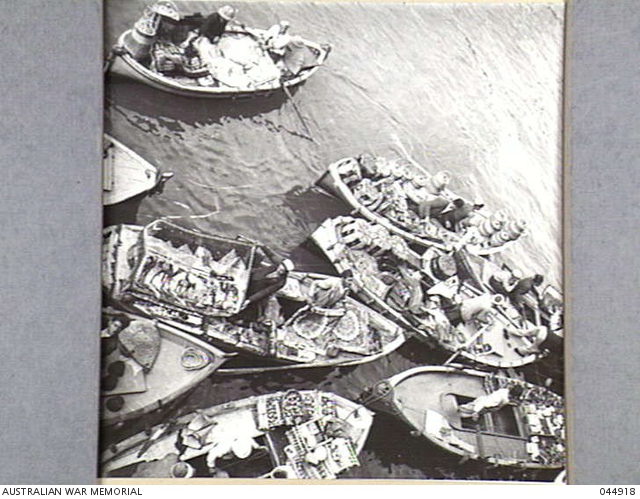 LOCAL TRADERS AROUND RMS ORONTES AT SUEZ, EGYPT. THE PHOTOGRAPH WAS ...