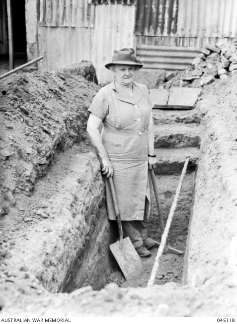 A 65 years old woman digging an air raid trench in her yard in Adelaide ...