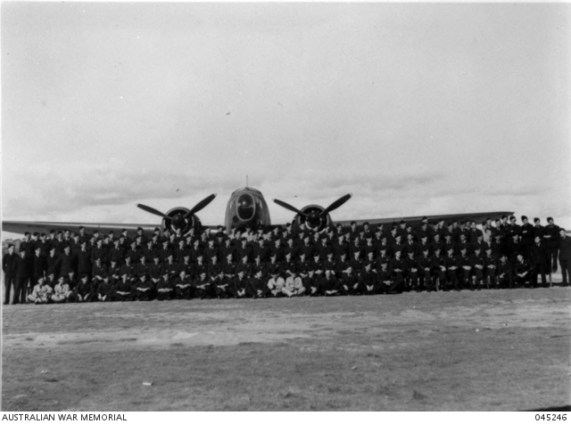 Group portrait of No 8 Squadron, RAAF, taken in front of one of the ...