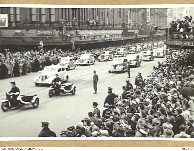 THE MARCH OF TROOPS OF THE 9TH AUSTRALIAN DIVISION THROUGH THE CITY OF ...