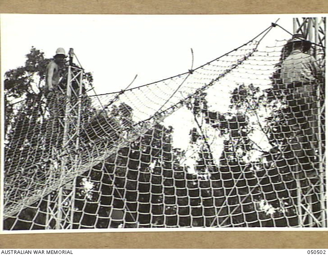 LANGWARRIN, AUSTRALIA. 1943-04. ARMY PERSONNEL ERECTING A SPECIALLY ...