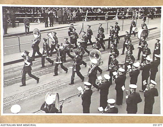 MELBOURNE, VIC. 1943-04-16. A BAND OF THE RAAF PASSES THE SALUTING BASE ...