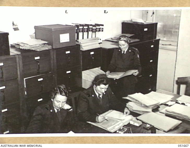 MELBOURNE, AUSTRALIA. 1943-05-13. THREE RED CROSS OFFICERS AT WORK ON ...