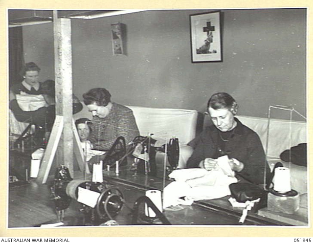 MELBOURNE, VIC. 1943-05-21. A VOLUNTARY RED CROSS WORKER AND A MEMBER ...