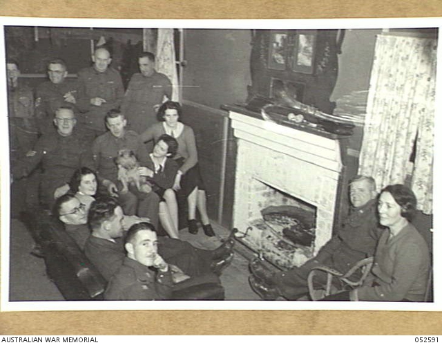 TATURA, VIC. 1943-06-19. RELAXING AFTER A GUEST NIGHT DINNER IN THE ...