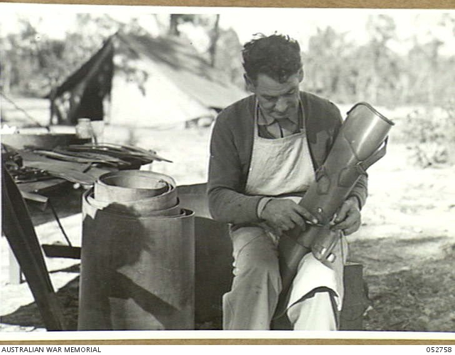 GIN GIN, WA. 1943-06-21. WX87250 CORPORAL T. SPENCER, MAKES A BREN GUN ...