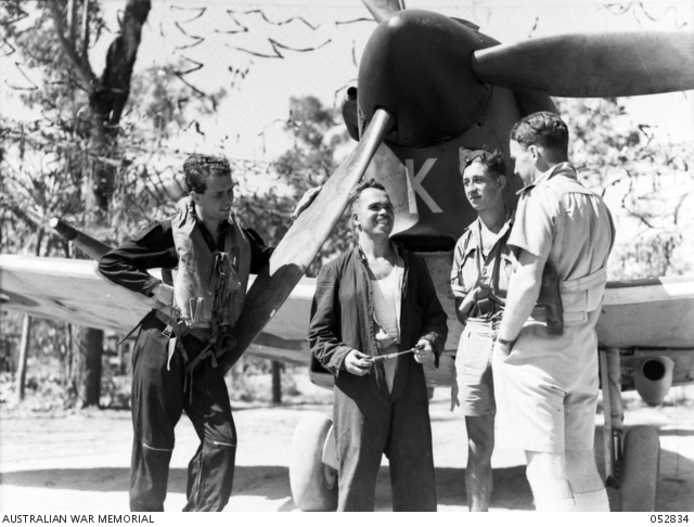 DARWIN, NT. 1943-06-22. CHATTING IN FRONT OF A SPITFIRE AIRCRAFT AFTER ...