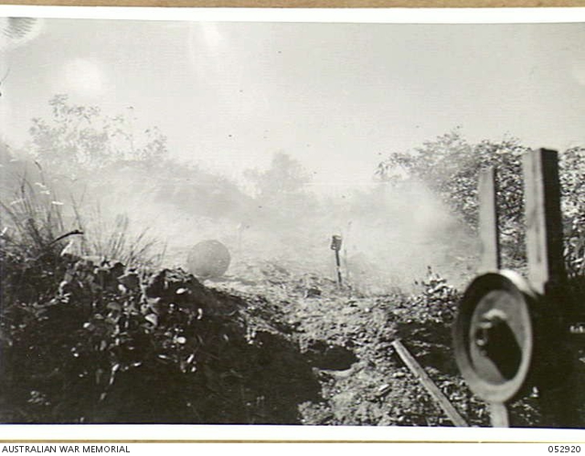 DARWIN, NT. 1943-06-25. CLOUDS OF DUST RISING FROM THE MOUND BEHIND THE ...