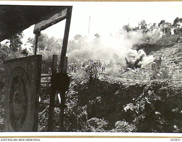 DARWIN, NT. 1943-06-25. CLOUDS OF DUST RISING FROM THE MOUND BEHIND THE ...