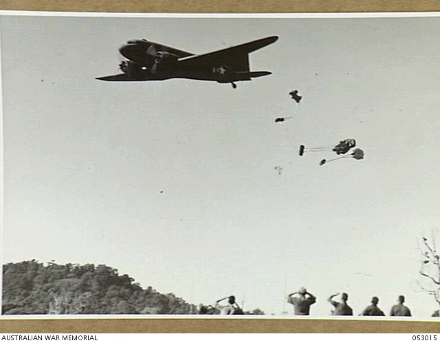 PARACHUTES OPEN AS THEY LEAVE THE LOW FLYING AIRCRAFT CARRYING FOOD ...