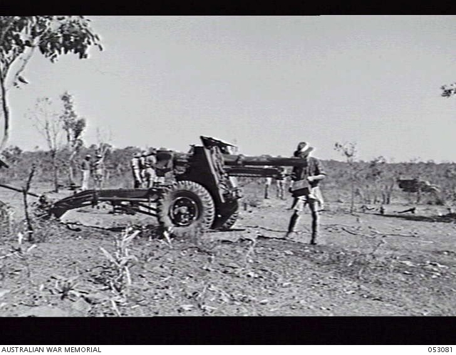 DARWIN, NT. 1943-06-28. TO REDUCE DUST, GUN CREWS OF THE 2/11TH ...