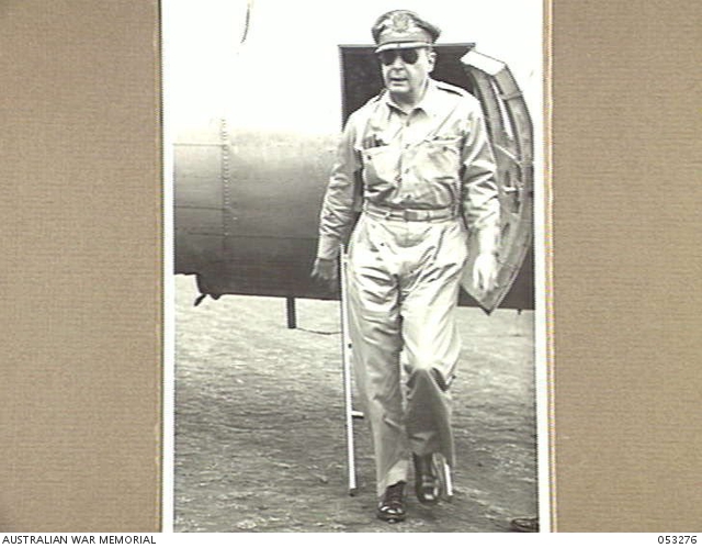 MAREEBA, QLD. 1943-07-05. GENERAL MACARTHUR STEPS FROM HIS AIRCRAFT AT ...
