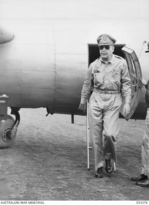 MAREEBA, QLD. 1943-07-05. GENERAL MACARTHUR STEPS FROM HIS AIRCRAFT AT ...
