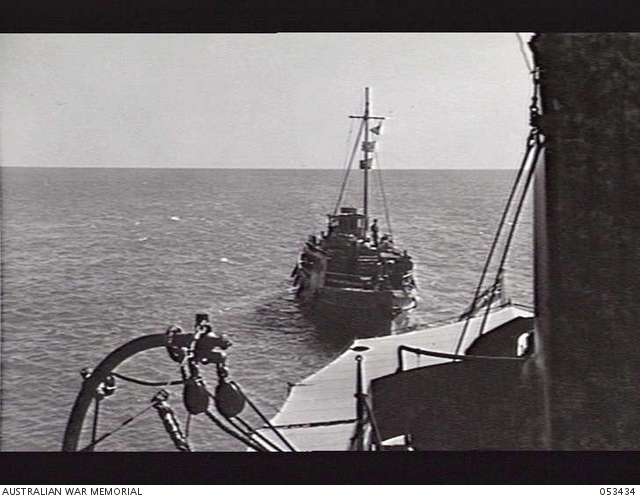 DARWIN, NT. 1943-07-06. SUPPLY VESSEL DRAWING ALONGSIDE BOOM WORKING ...