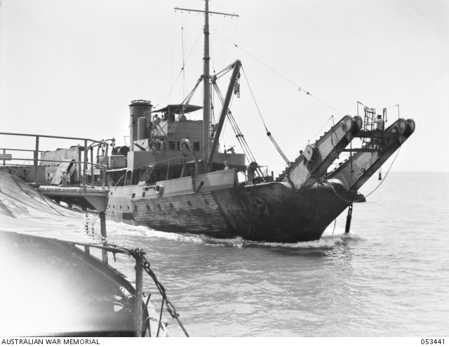 The Bar class boom working vessel, HMAS Koala, passing through the boom ...