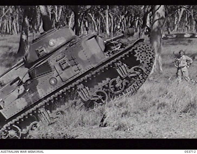 ATHERTON TABLELANDS, QLD. 1943-07-02. TANK COMING OUT OF A DRY CREEK ...
