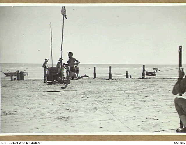 MINDIL BEACH, DARWIN, NT. 1943-07-15. GUNNER CLAMP WINNING THE 880 ...