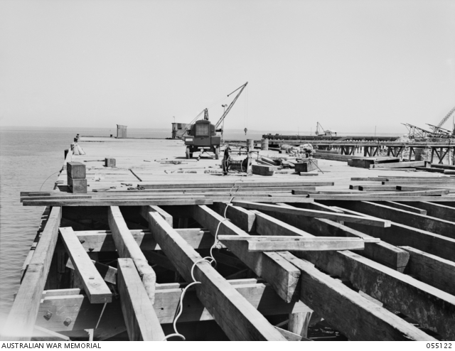 DARWIN, NT. 1943-08-08. NEW WHARF IN THE COURSE OF CONSTRUCTION TO ...