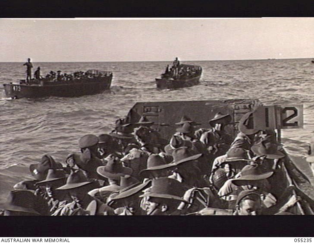 CAIRNS, QLD. 1943-08-08. BARGES FILLED WITH TROOPS OF THE 9TH ...