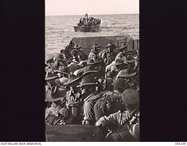 CAIRNS, QLD. 1943-08-08. BARGES FILLED WITH TROOPS OF THE 9TH ...