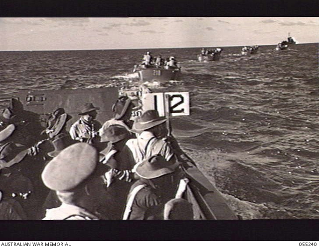 CAIRNS, QLD. 1943-08-08. BARGES FILLED WITH TROOPS OF THE 9TH ...