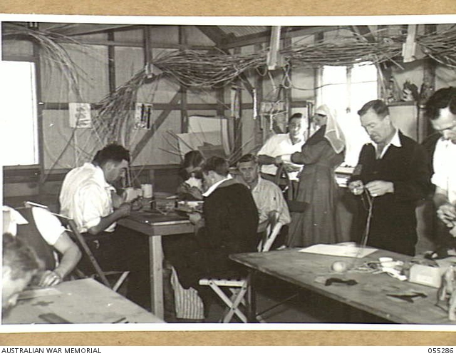ROCKY CREEK, QLD. 1943-08-11. SISTER C. R. MUMMERY SHOWING PATIENTS HOW ...
