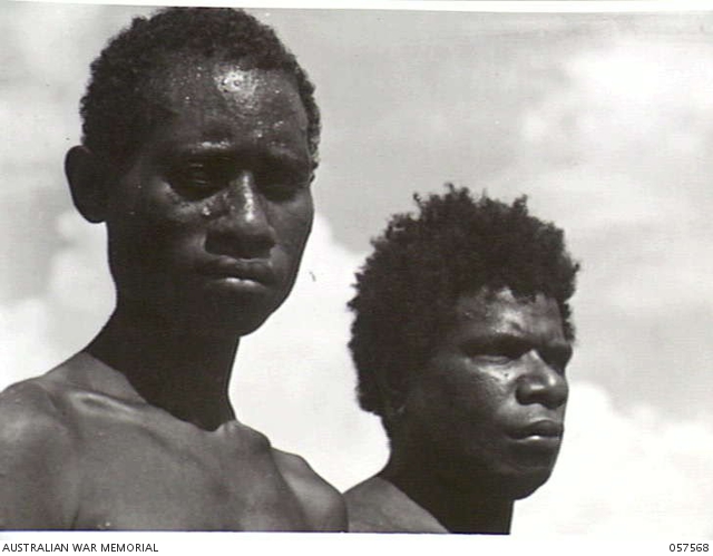 SALAMUA, NEW GUINEA. 1943-09-20. TWO NATIVE LABOURERS. THE ONE ON THE ...
