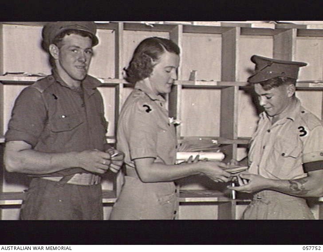 CAIRNS, QLD. 1943-09-29. DESPATCH RIDERS AND CLERK AT THE 57TH ...