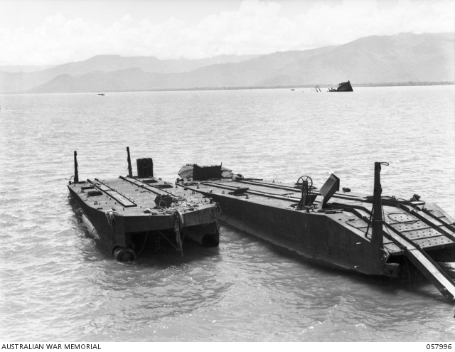 LAE, NEW GUINEA. 1943-10-12. CAPTURED JAPANESE BARGES RUSTING IN THE ...